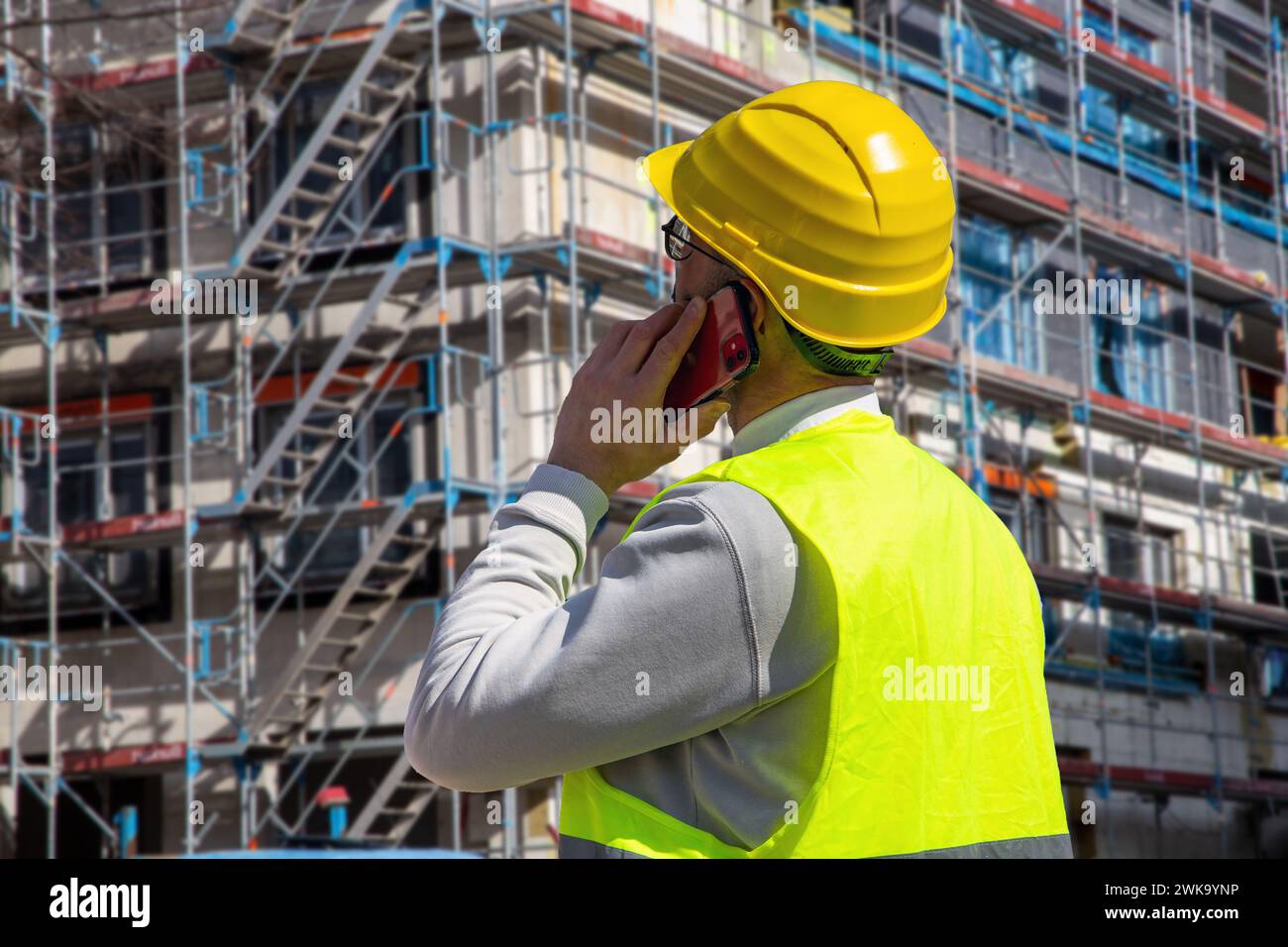 Symbol image: Architect in front of an apartment building under ...