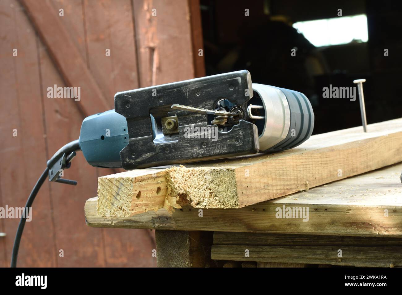 The carpenter left his tool called a jigsaw, an electric tool for ...