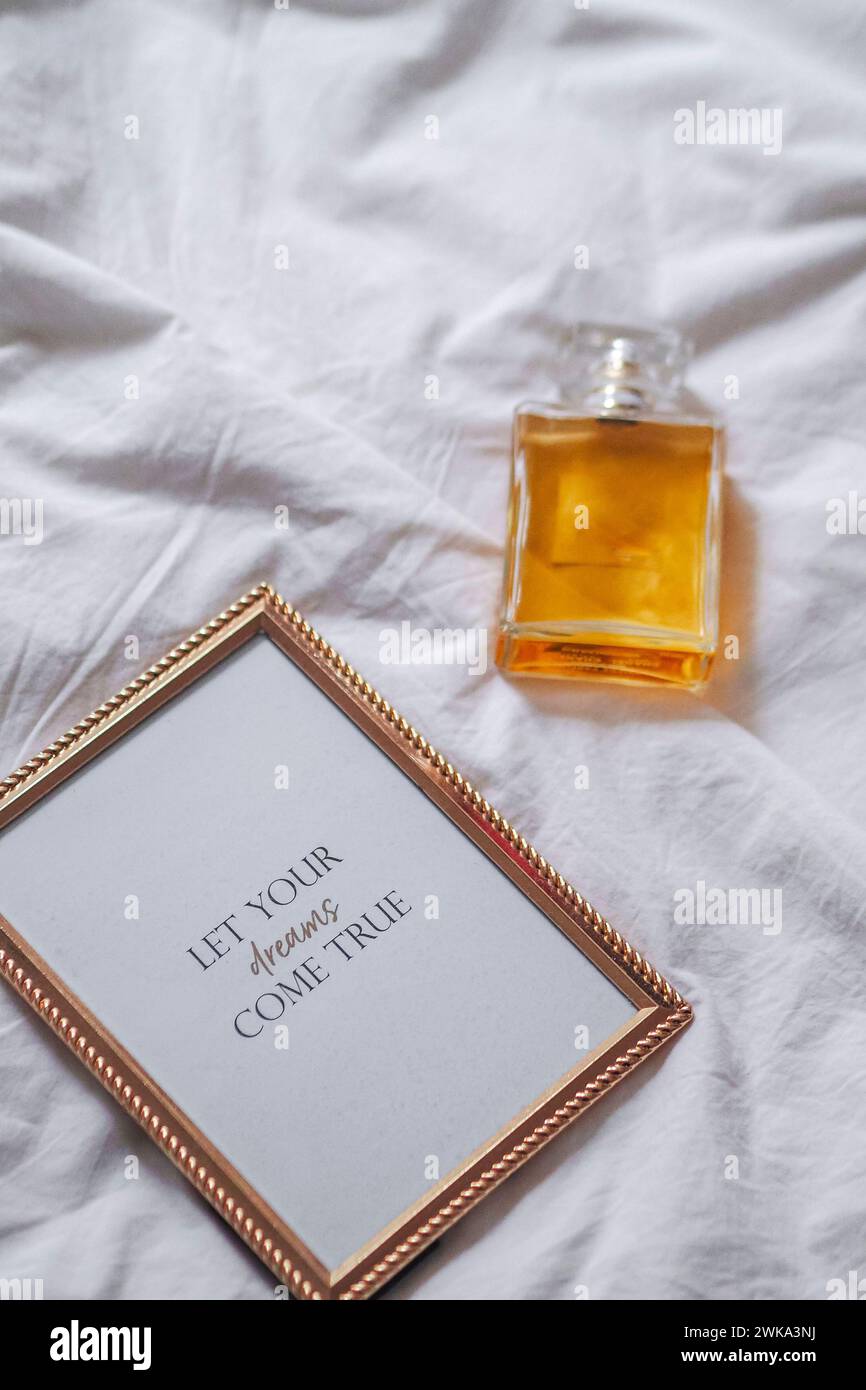A close-up of perfume bottle and object on bed Stock Photo - Alamy
