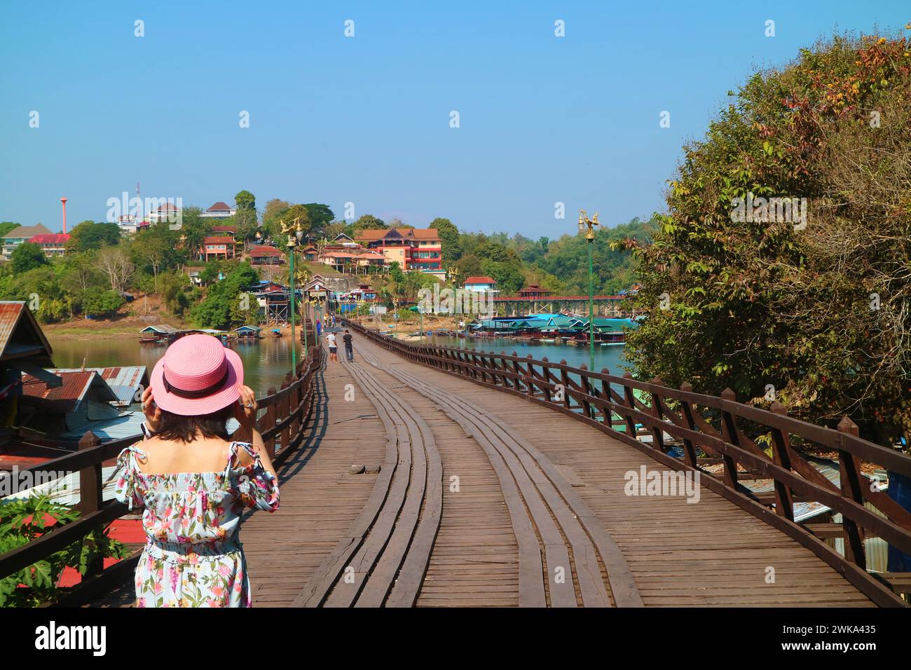 Woman walking on The Mon Bridge, Thailand's Longest Wooden Bridge in ...