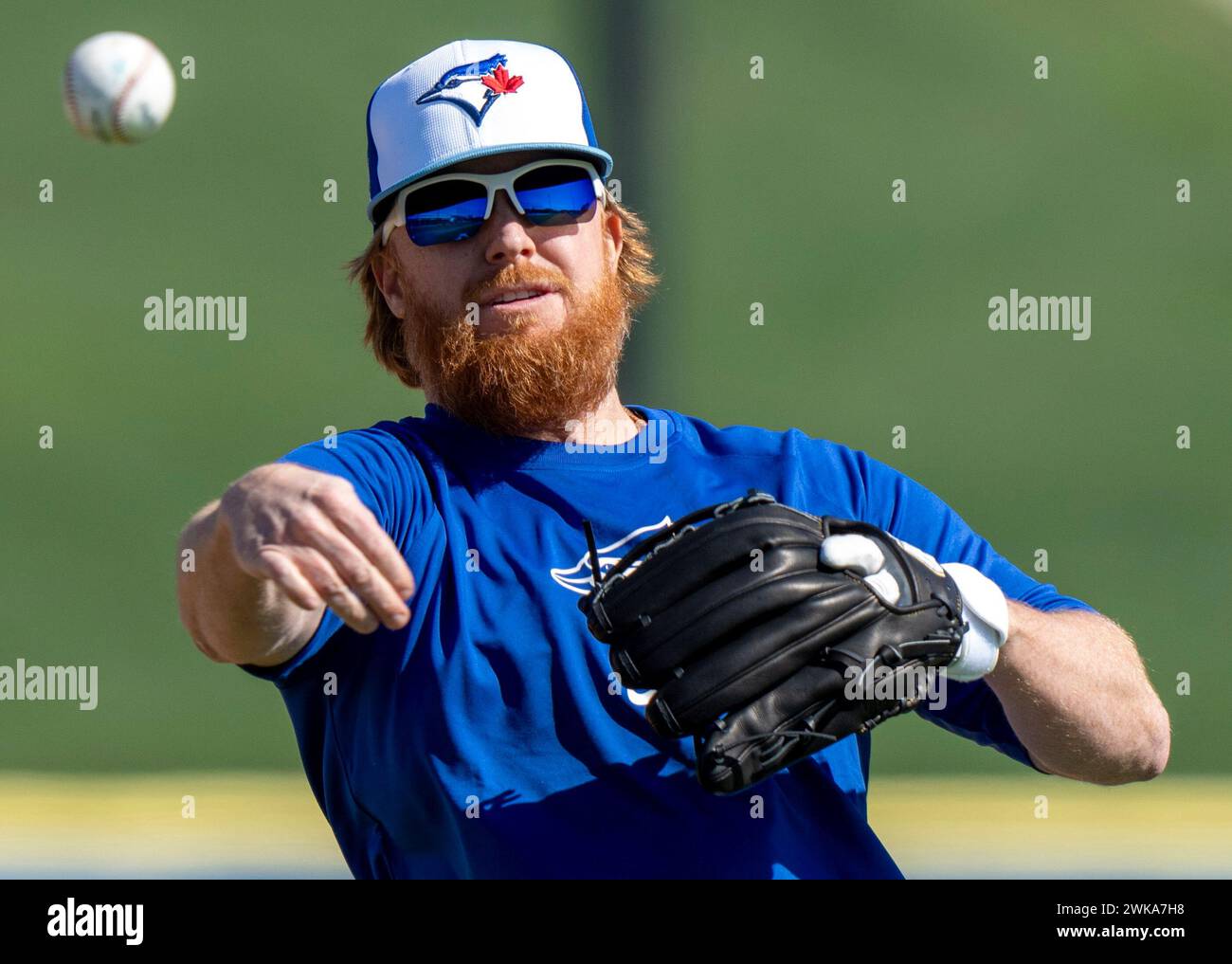 Toronto Blue Jays' Justin Turner throws a ball at baseball spring ...