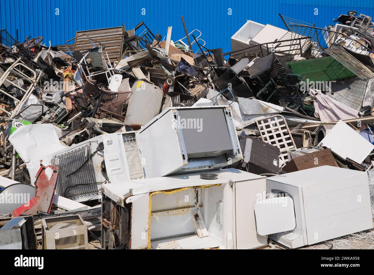 Pile of discarded household and industrial items at scrap metal ...