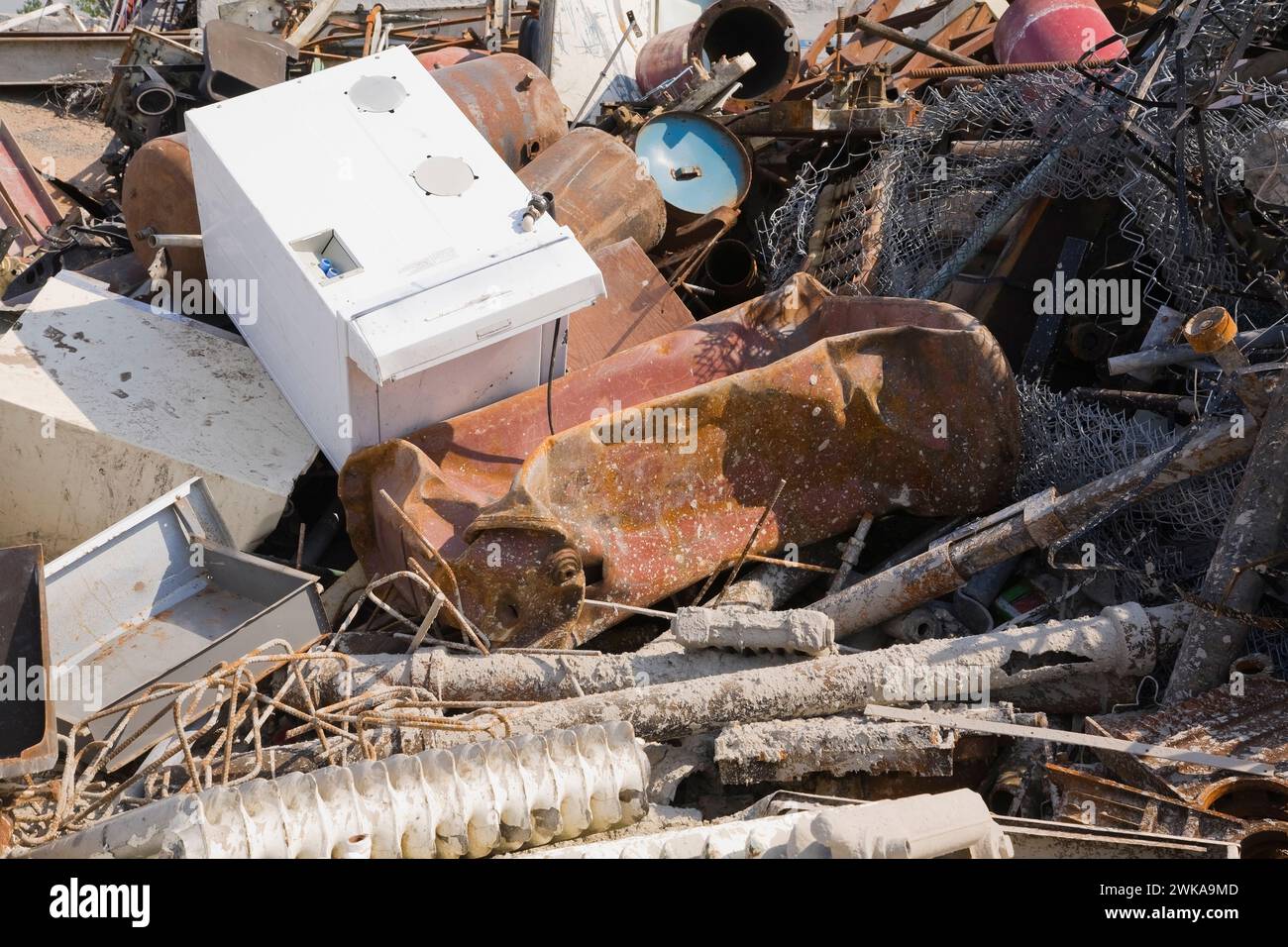 Pile of discarded household and industrial items at scrap metal ...