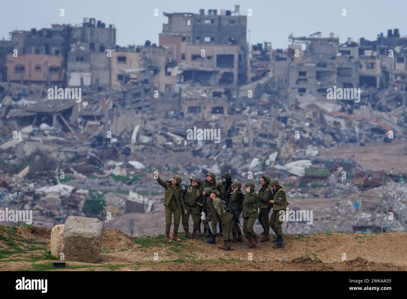 Israeli female soldiers pose for a photo on a position on the Gaza ...