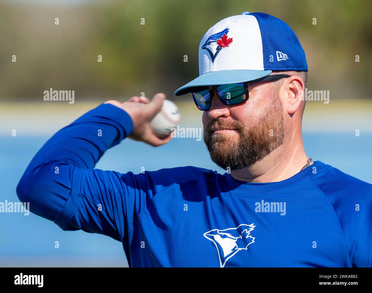 Toronto Blue Jays manager John Schneider throws a ball at baseball ...