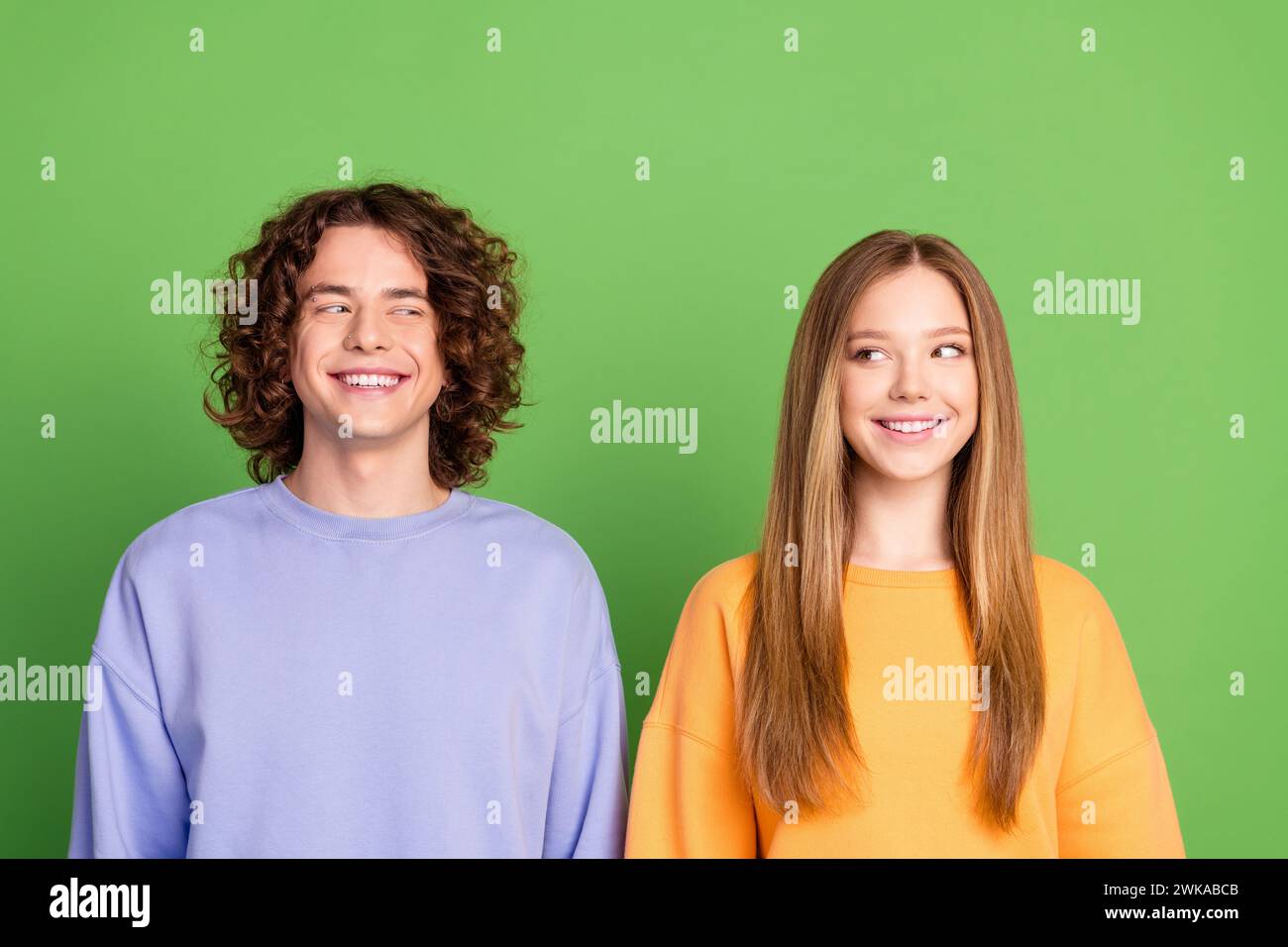 Photo portrait of pretty young teen girl boy look interested each other ...