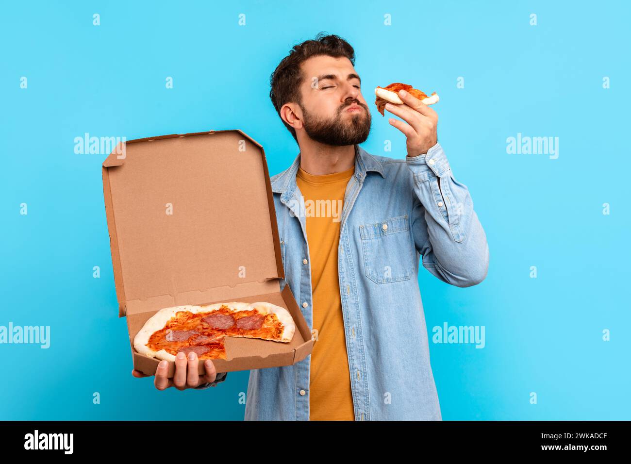 Young man eats junk food hi-res stock photography and images - Alamy