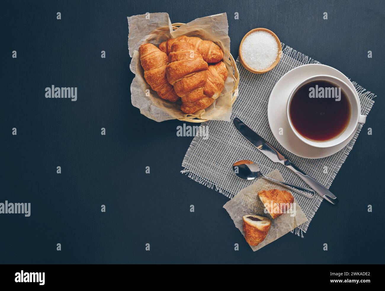 Freshly baked croissants on a wooden table. Breakfast with croissants ...