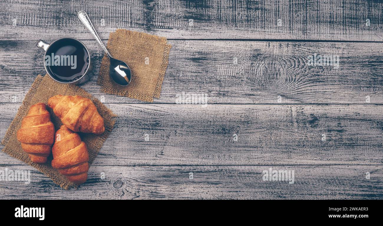 Freshly baked croissants on a wooden table. Breakfast with croissants ...