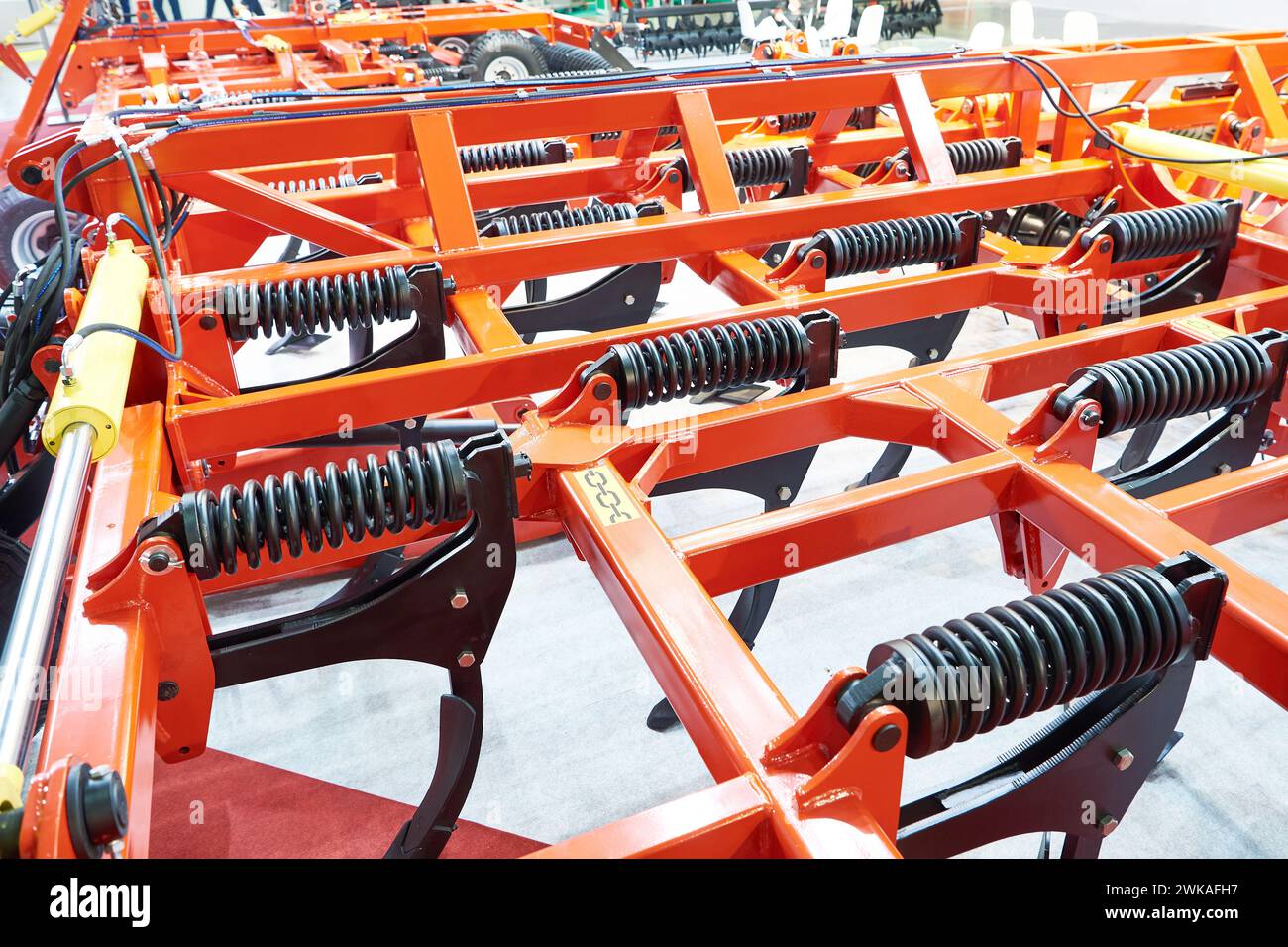 Universal row crop cultivator with spring struts at the agricultural ...
