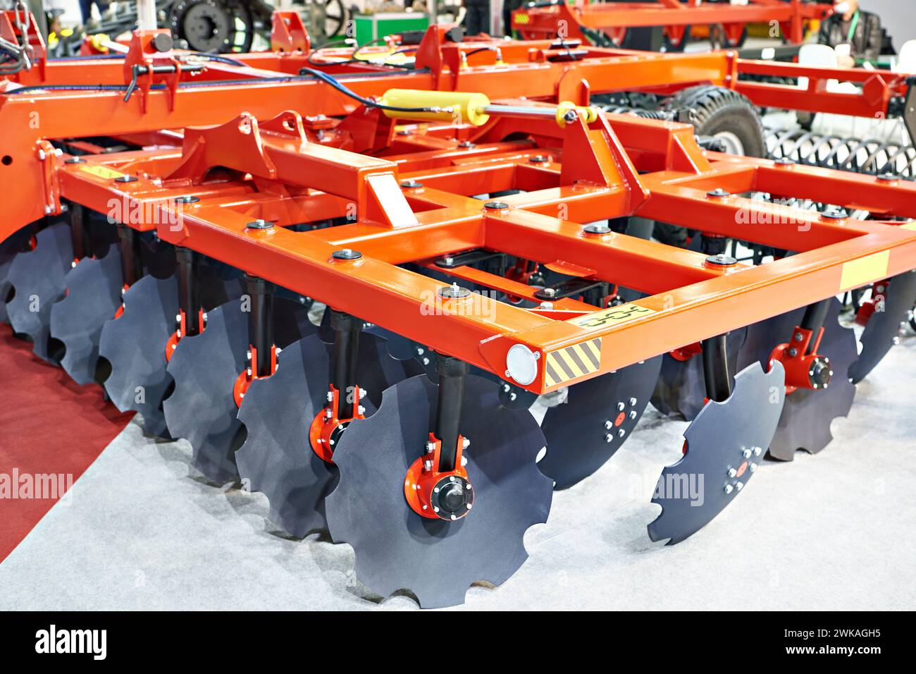 Trailed in-line disc harrow at an agricultural exhibition Stock Photo ...
