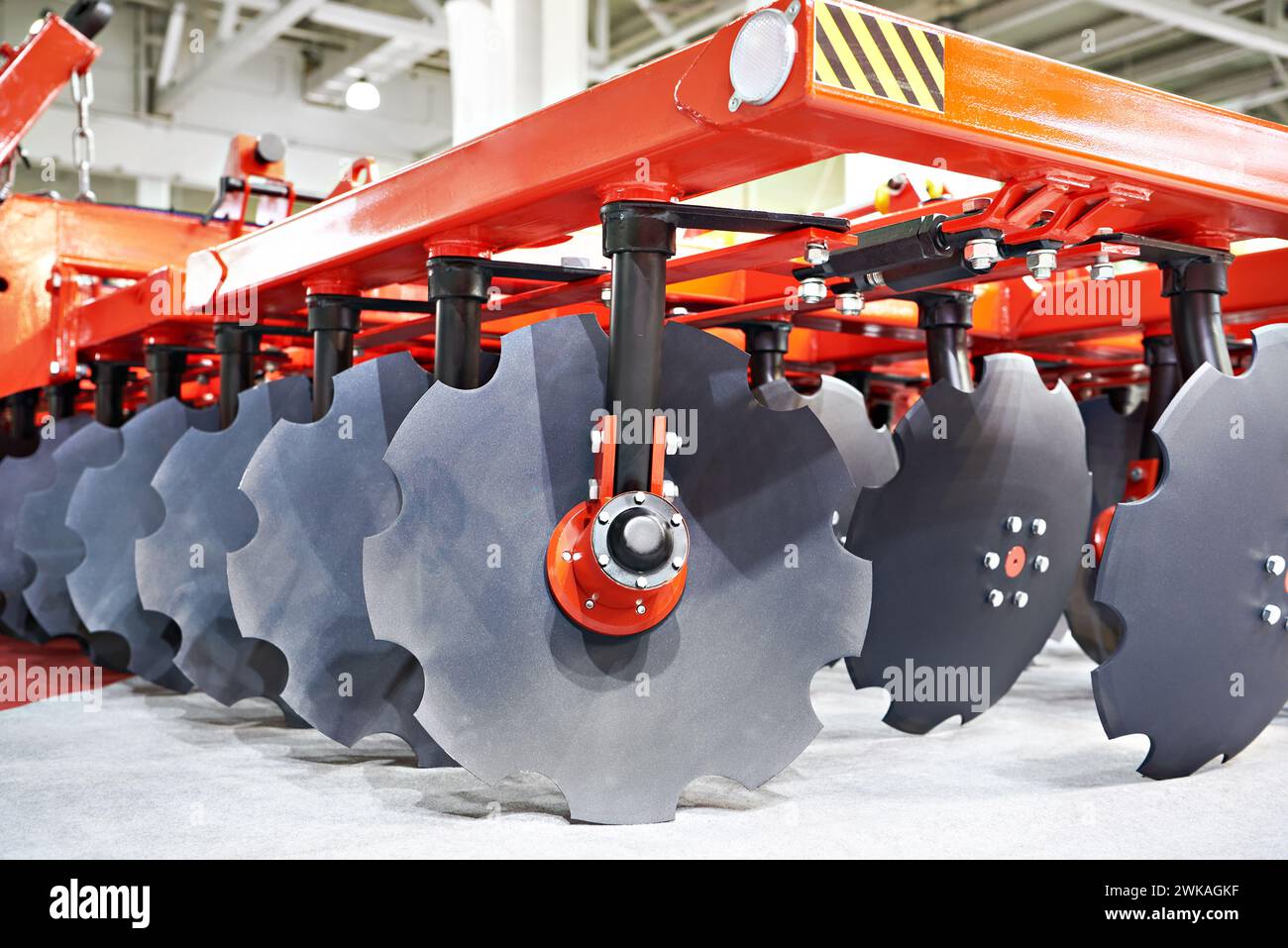 Trailed in-line disc harrow at an agricultural exhibition Stock Photo ...