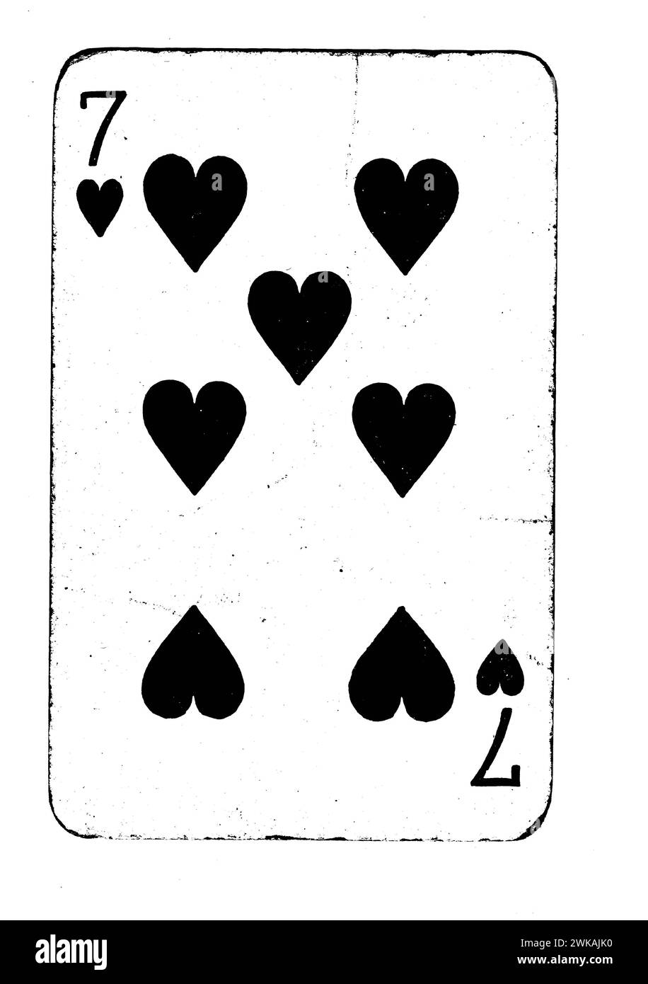 A vintage seven of hearts playing card in black and white isolated on a ...