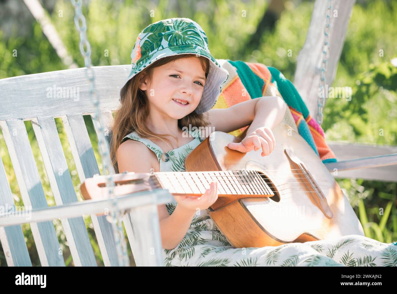 Little child playing guitar. Fashion kid girl. Kids music guitar school ...