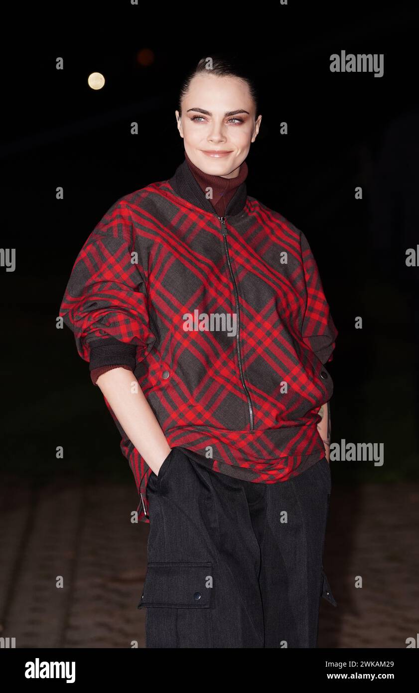 Cara Delevingne attends the Burberry show in Victoria Park, east London ...