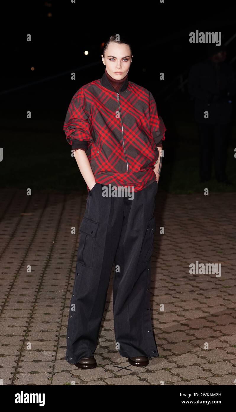 Cara Delevingne attends the Burberry show in Victoria Park, east London ...