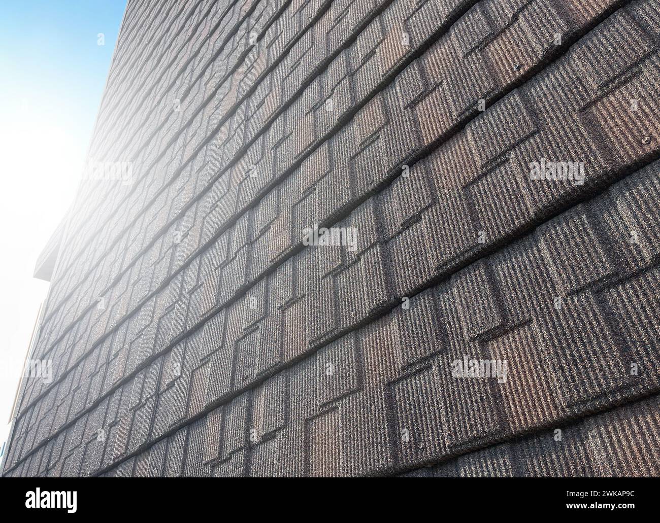 Voluminous composite shingles with asymmetrical shape Stock Photo - Alamy