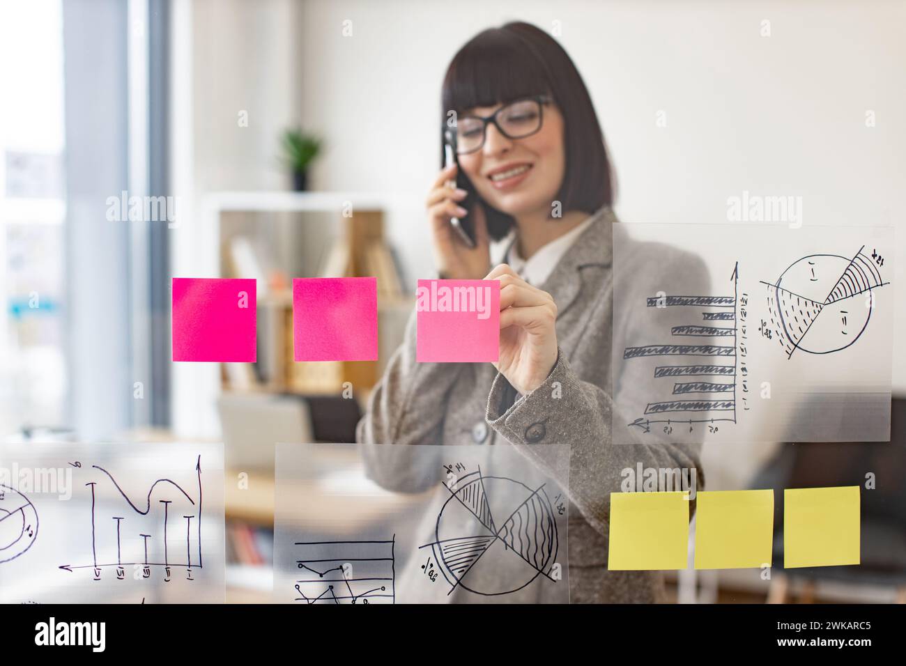 Female administrative manager preparing for presentation at work Stock ...