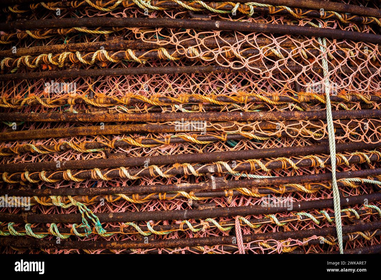 Netting and rope connected to rusted steel on fishing traps Stock Photo ...