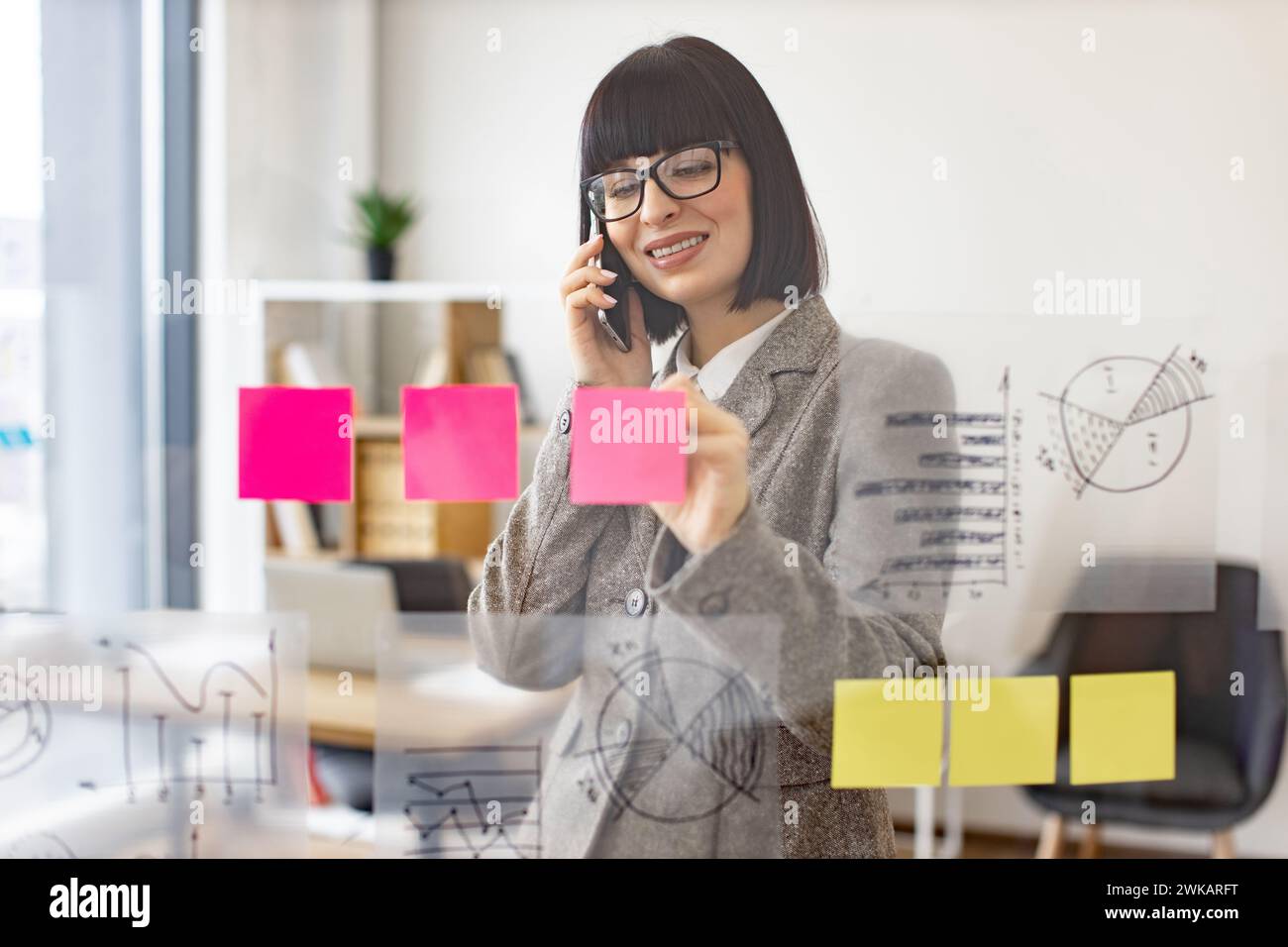 Female administrative manager preparing for presentation at work Stock ...