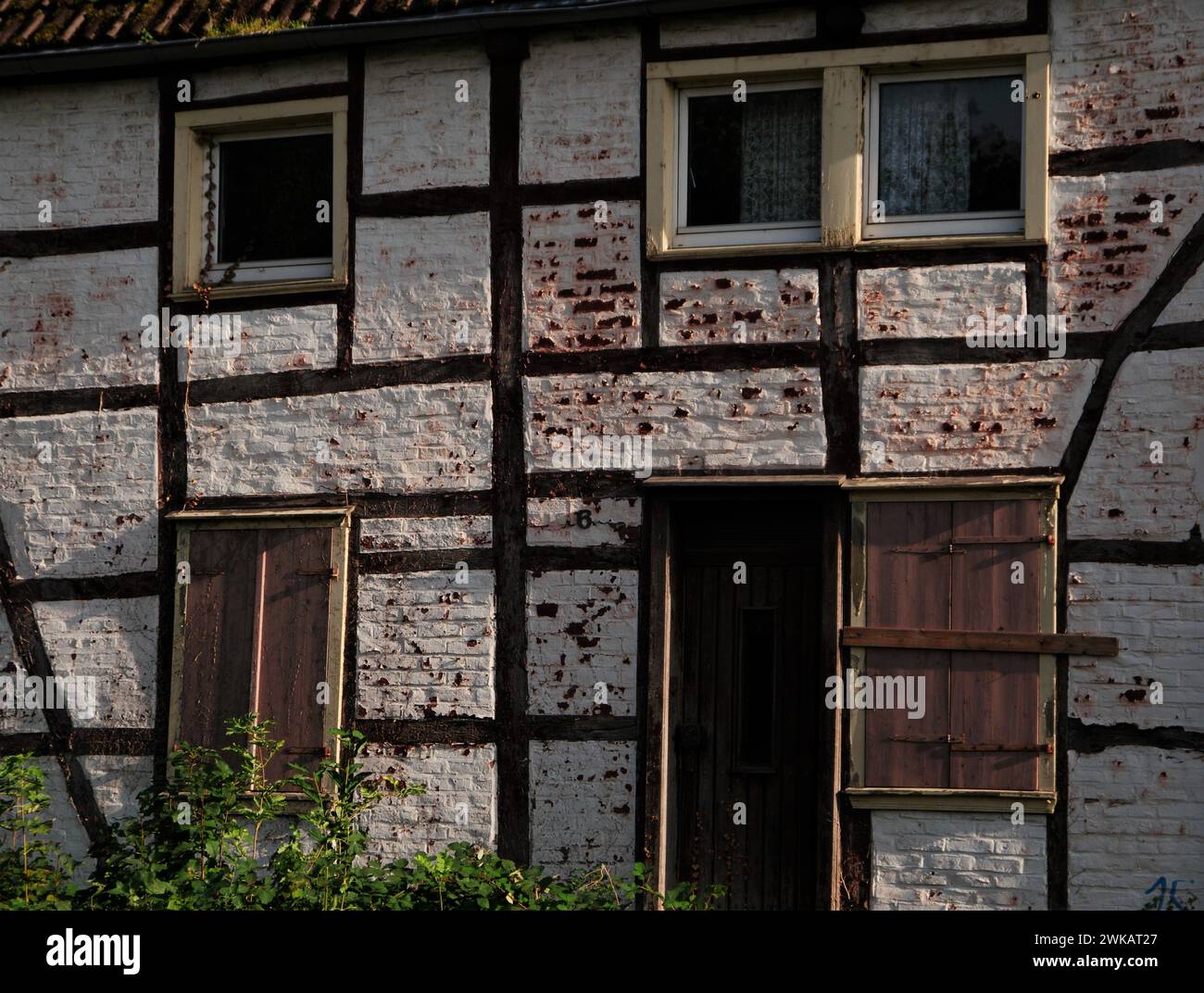 Details of a half-timbered house in need of renovation , over the ...