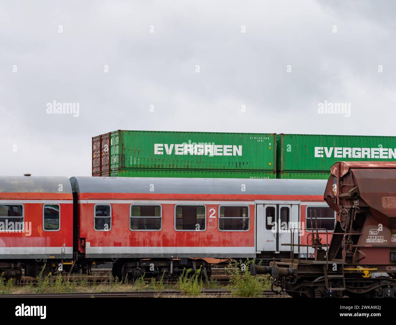 Evergreen shipping container at a cargo transshipment point. The ...