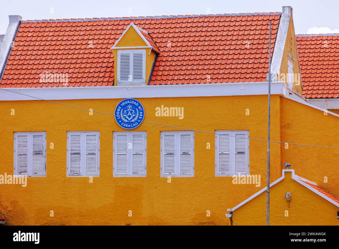 View of colorful orange police station building in Willemstad, Curacao ...