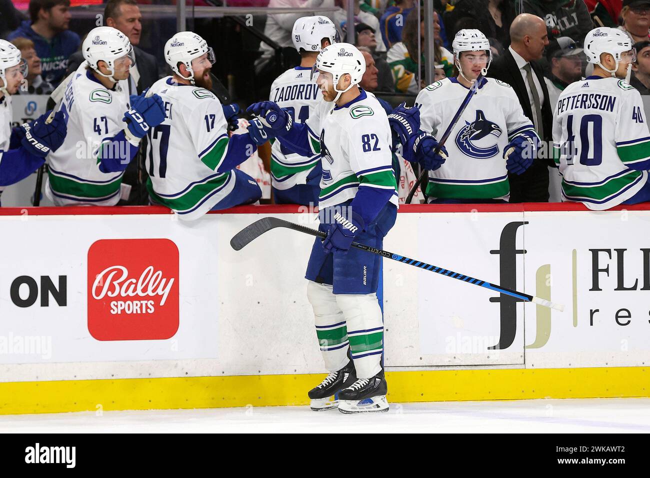 Vancouver Canucks defenseman Ian Cole, center, is congratulated for his ...