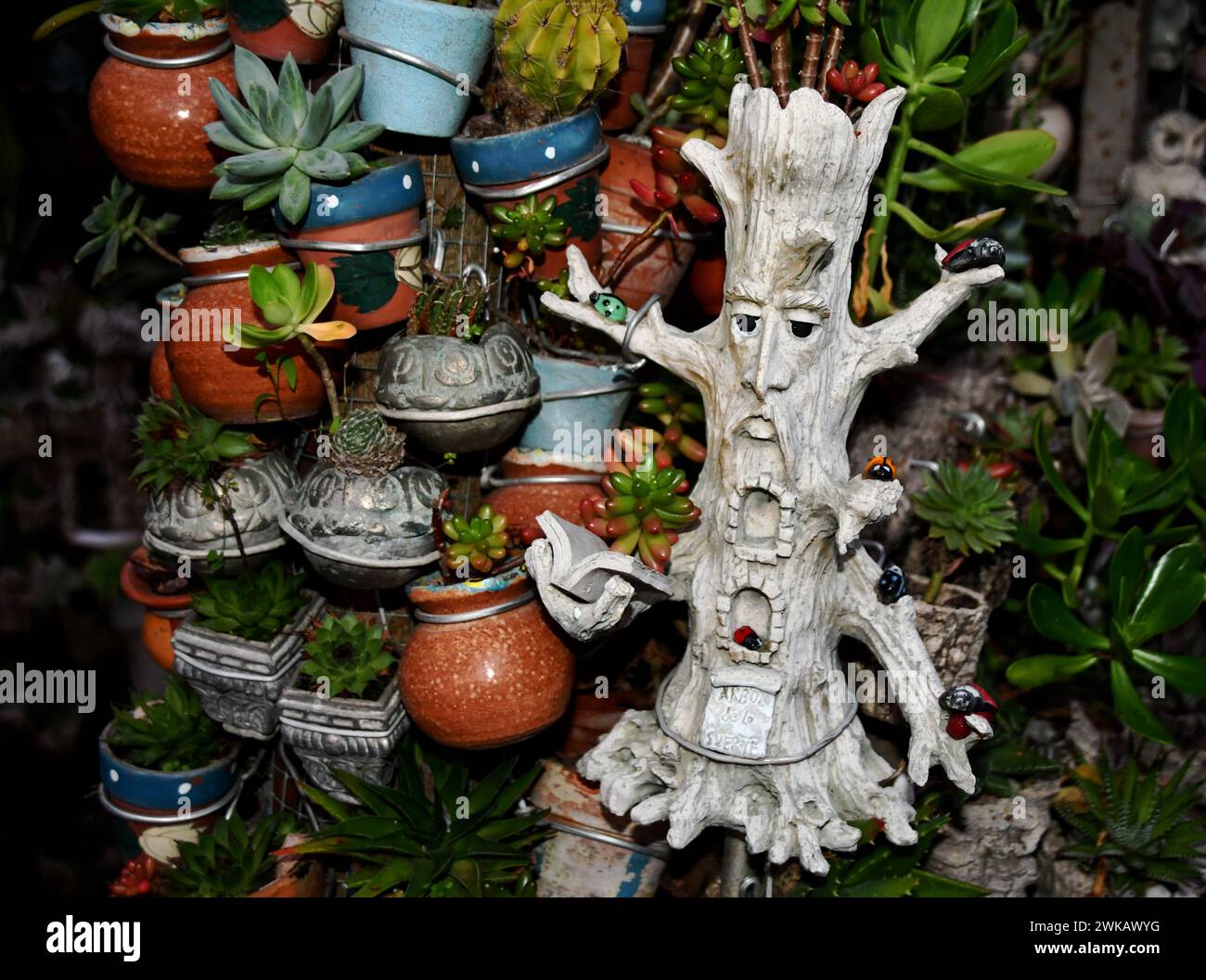 Small figure of the tree of wisdom hanging adorning a garden and ...