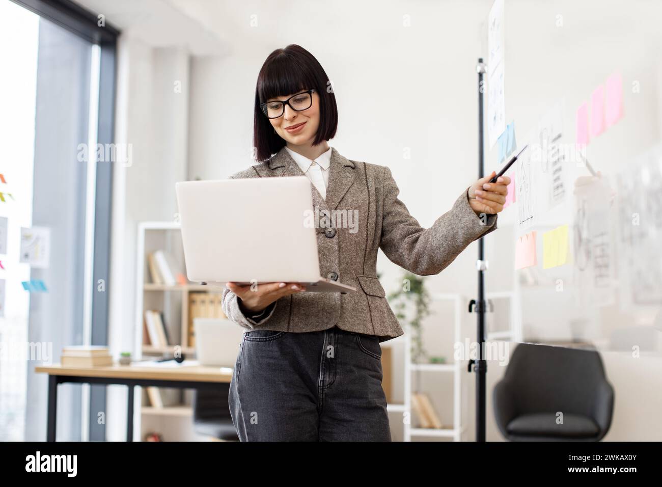 Female administrative manager preparing for presentation at work Stock ...