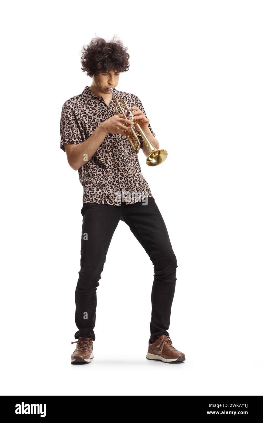 Full length shot of a cool male artist playing a trumpet isolated on ...