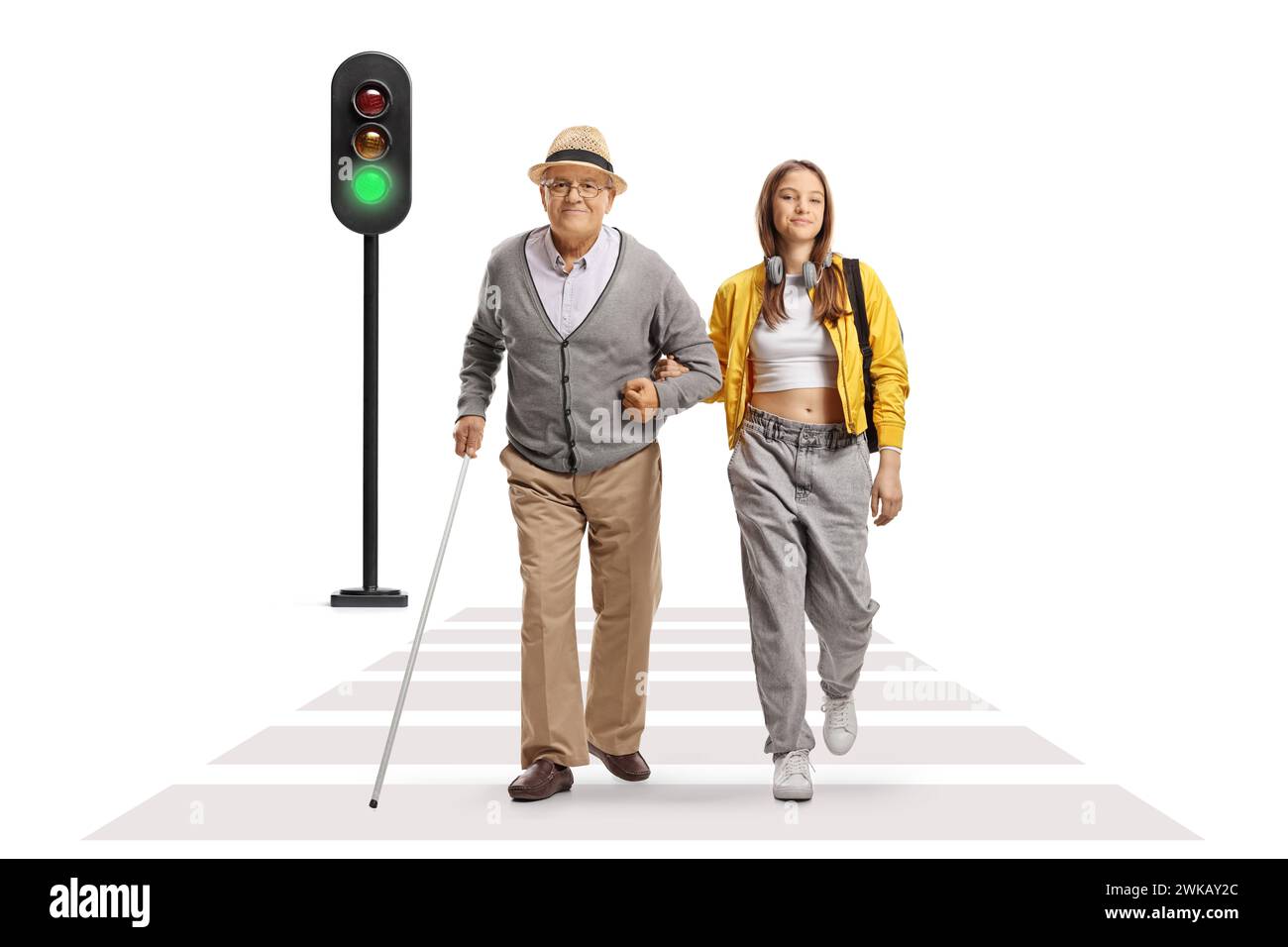 Young teenage girl helping an elderly man to cross a street isolated on ...