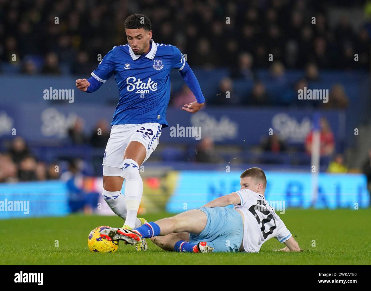 Liverpool, UK. 19th Feb, 2024. Ben Godfrey of Everton tackled by Adam ...