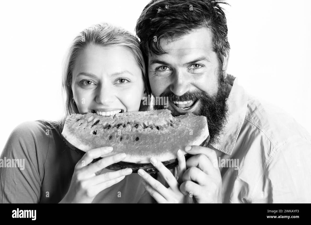 Romantic couple lovers eating watermelon, close up face, close up, isolated on white background ...