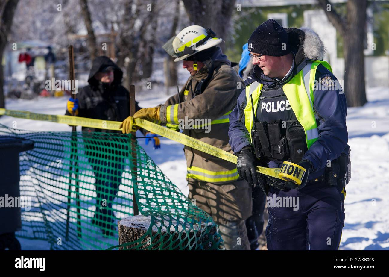 Davidson, Canada. 19th Feb, 2024. An RCMP officer sets up barrier tape ...