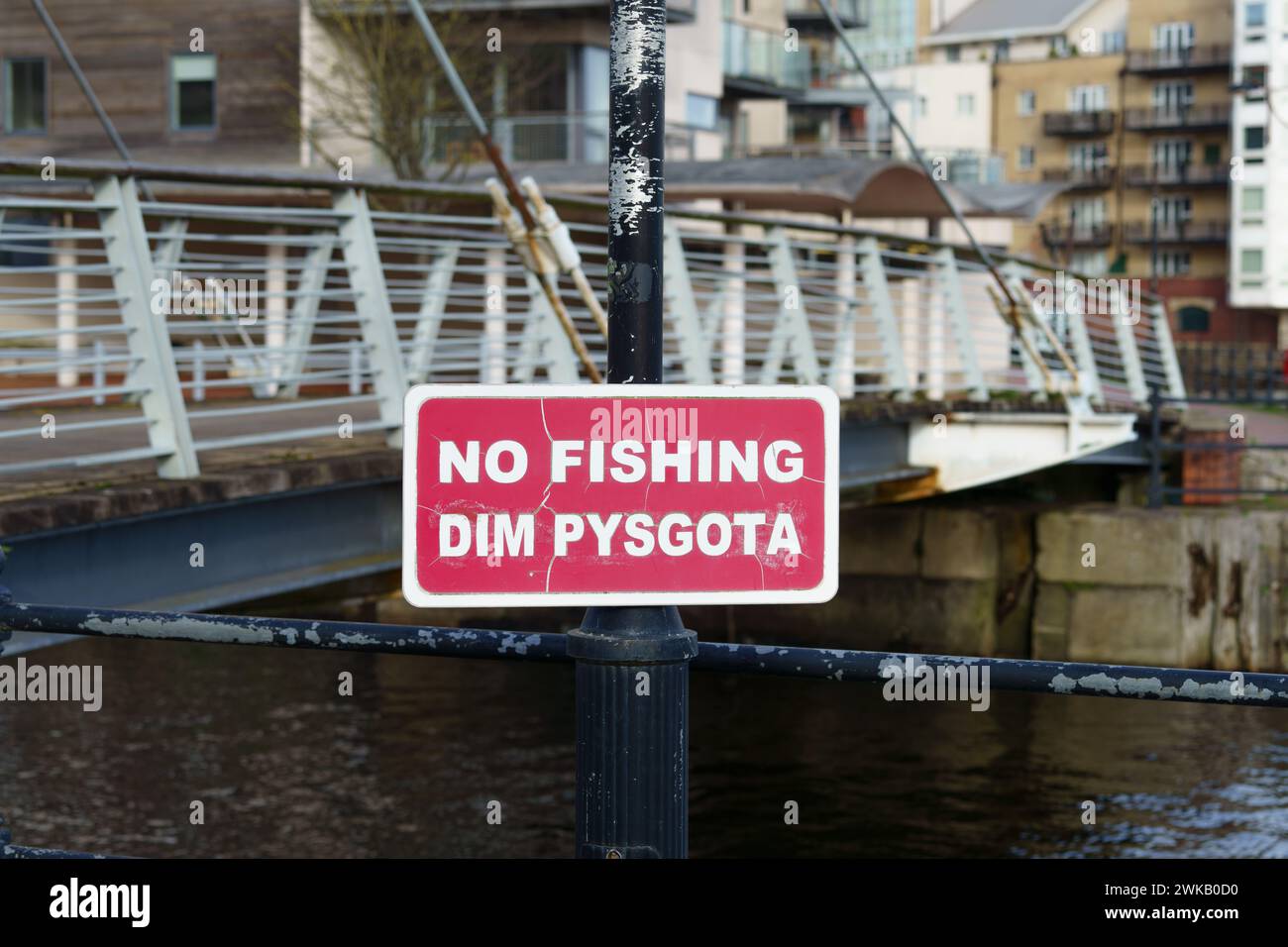 No Fishing sign (Welsh: Dim Pysgota) on a bridge on Cardiff Bay in the ...