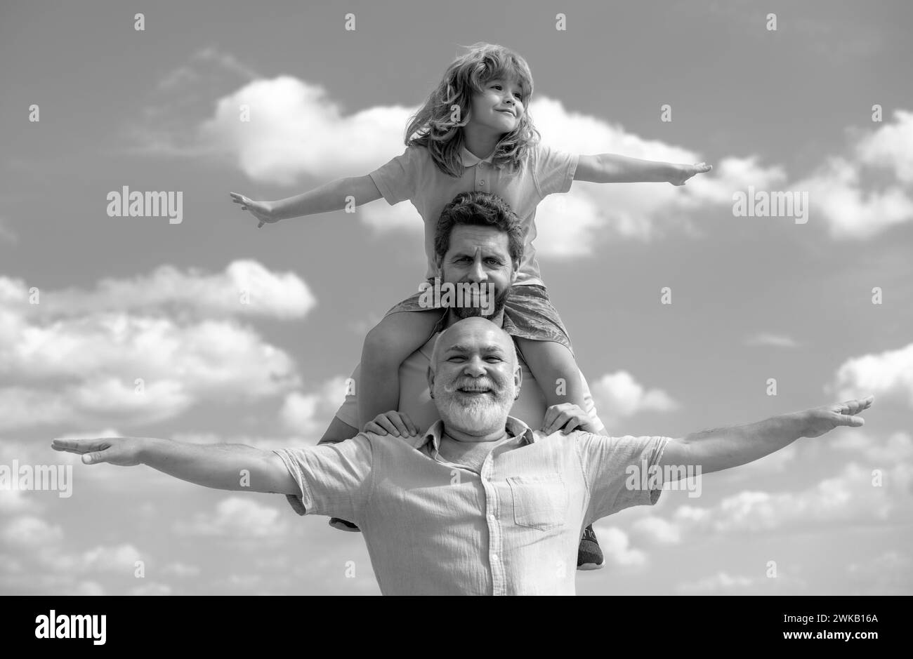 Portrait of parent grandfather, son and grandson raising hands or open ...