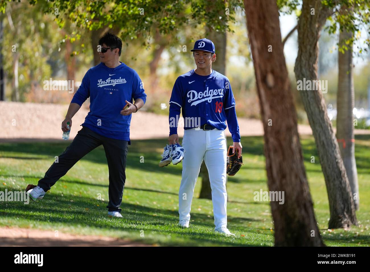 Los Angeles Dodgers starting pitcher Yoshinobu Yamamoto (18) walks with ...