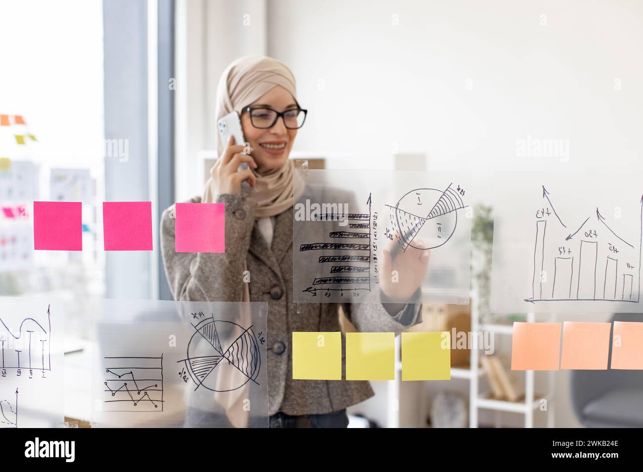 Female administrative manager preparing for presentation at work Stock ...