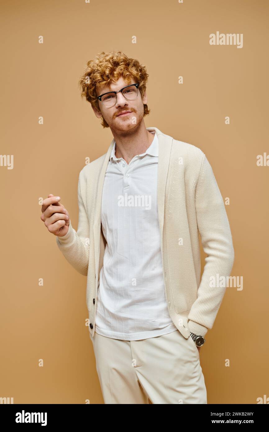 aristocratic man in eyeglasses and light-colored clothes standing with ...