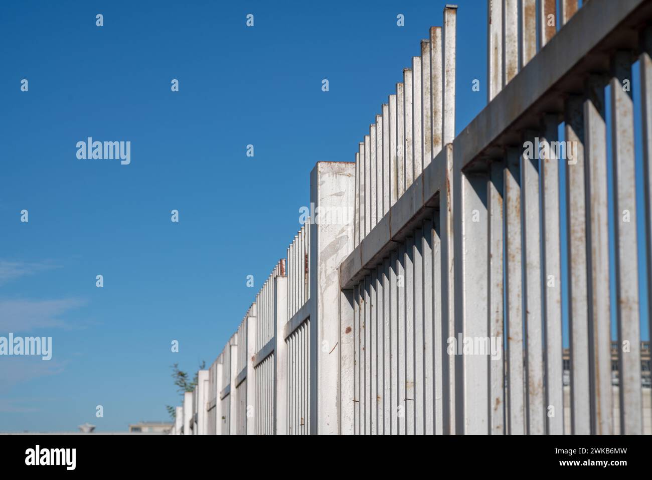 Borders, fence with steel metal grid. Detail of the grill is made with ...