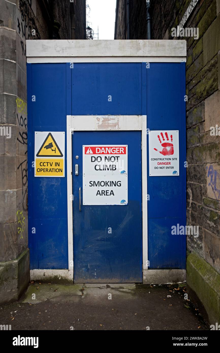 Warning signs at the entrance to a building site in Edinburgh, Scotland ...