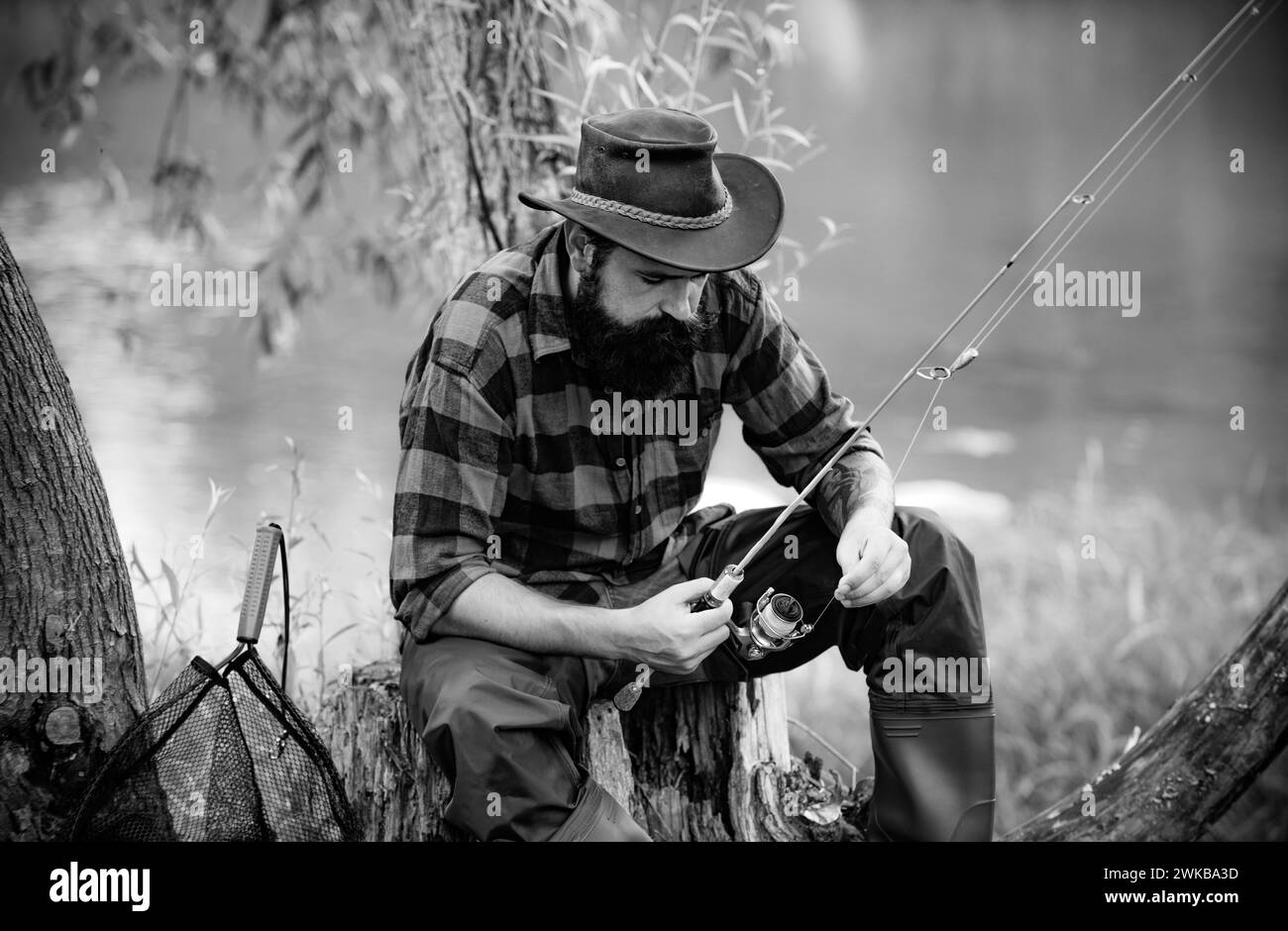 Elderly fisherman fishing rod Black and White Stock Photos & Images - Alamy