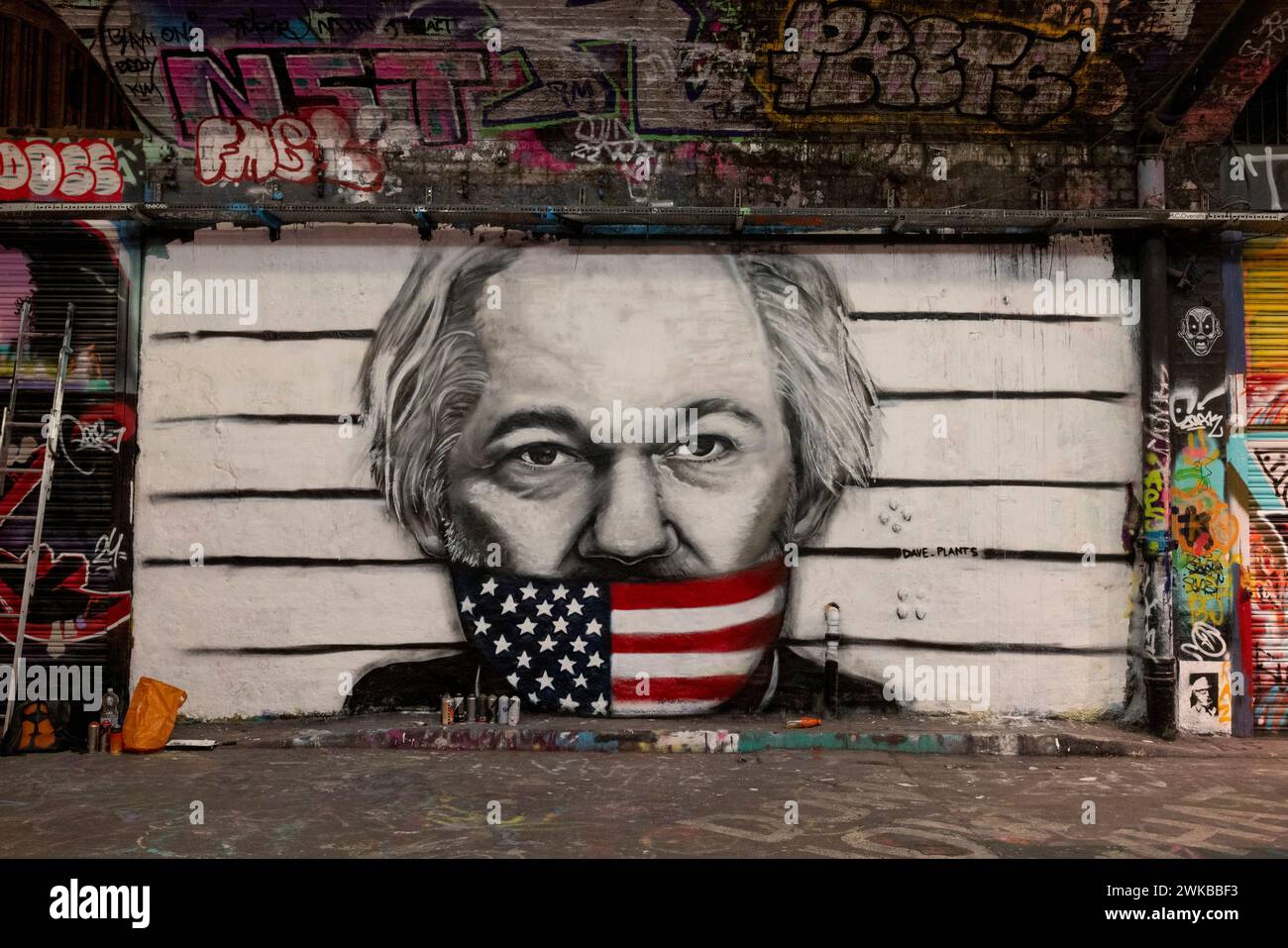 London, UK. 19th Feb, 2024. A graffiti depicting Julian Assange is seen ...