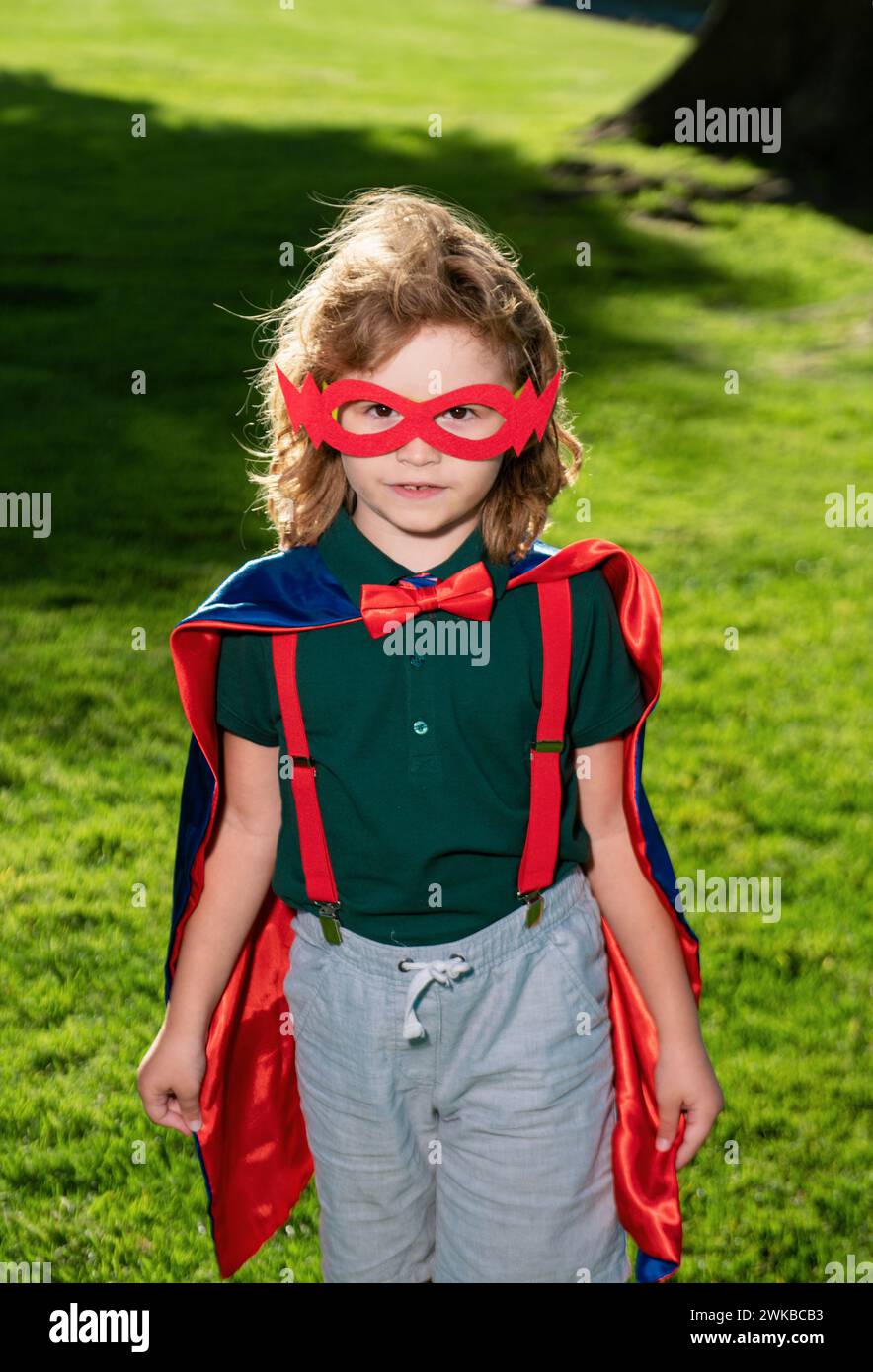 Superhero kid outdoor in park. Child power concept Stock Photo - Alamy