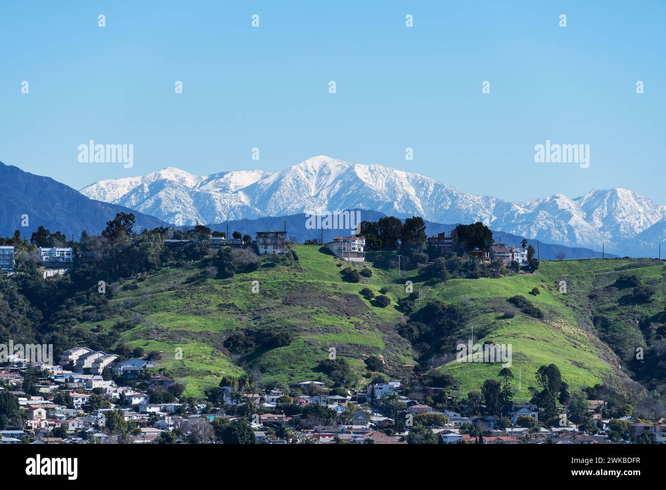 Snow capped Mt Baldy peak with the Los Angeles Mt Washington hillside ...