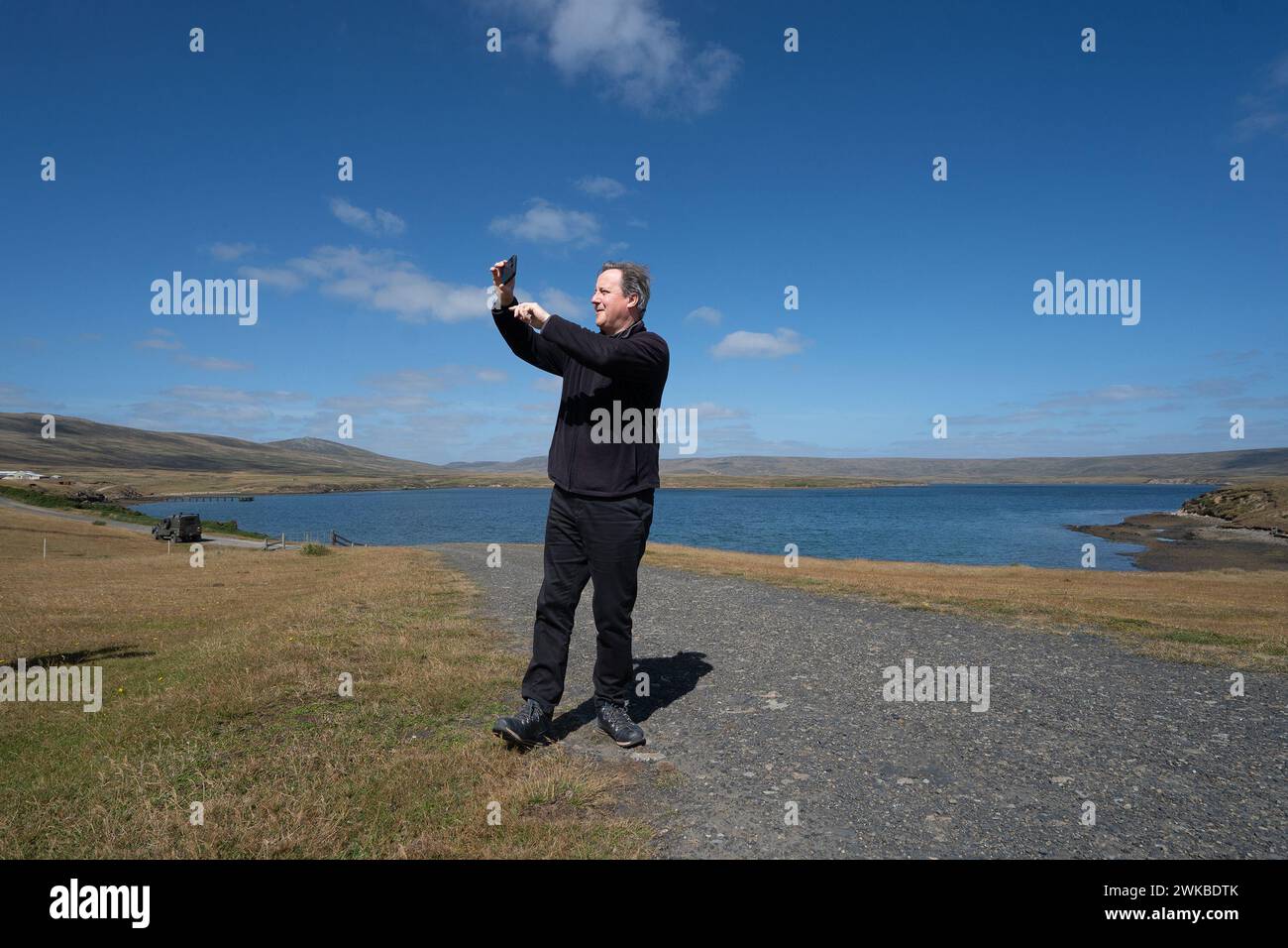 Foreign Secretary Lord David Cameron takes a photograph of San Carlos ...