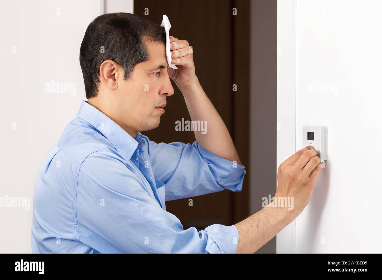 Shot of a sad business man sweating suffering a heat stroke and ...