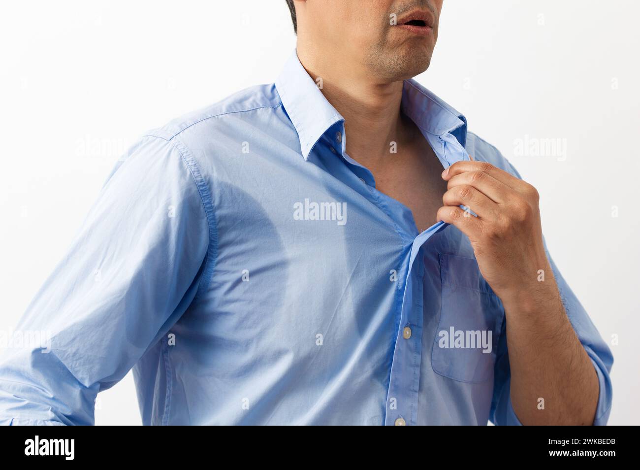Shot of an unrecognizable man dressing himself with white background ...