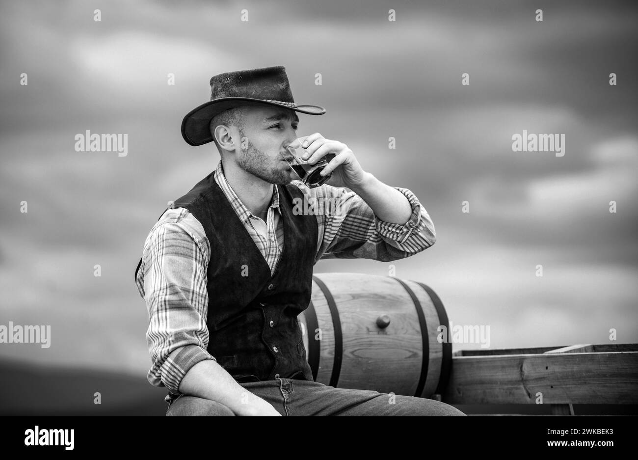 Cowboy drinking whiskey Black and White Stock Photos & Images - Alamy